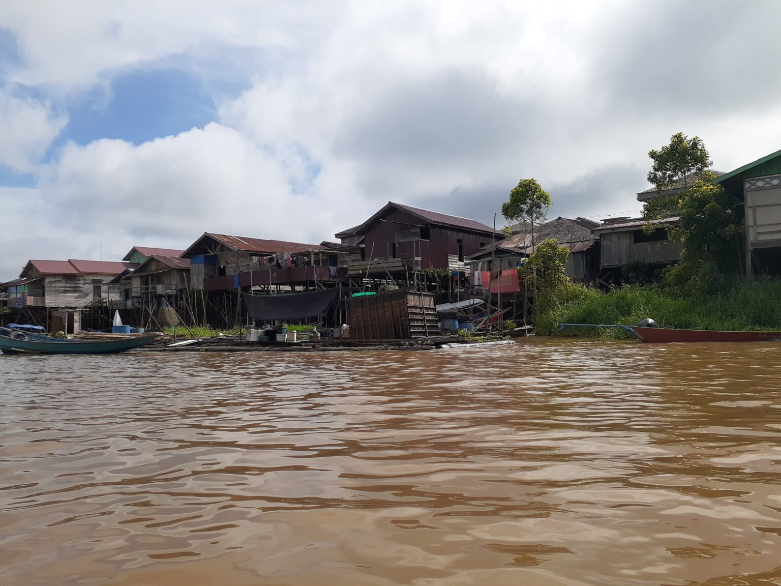 Watching Dolphins in the Mahakam River and Visiting Stilted Villages ...