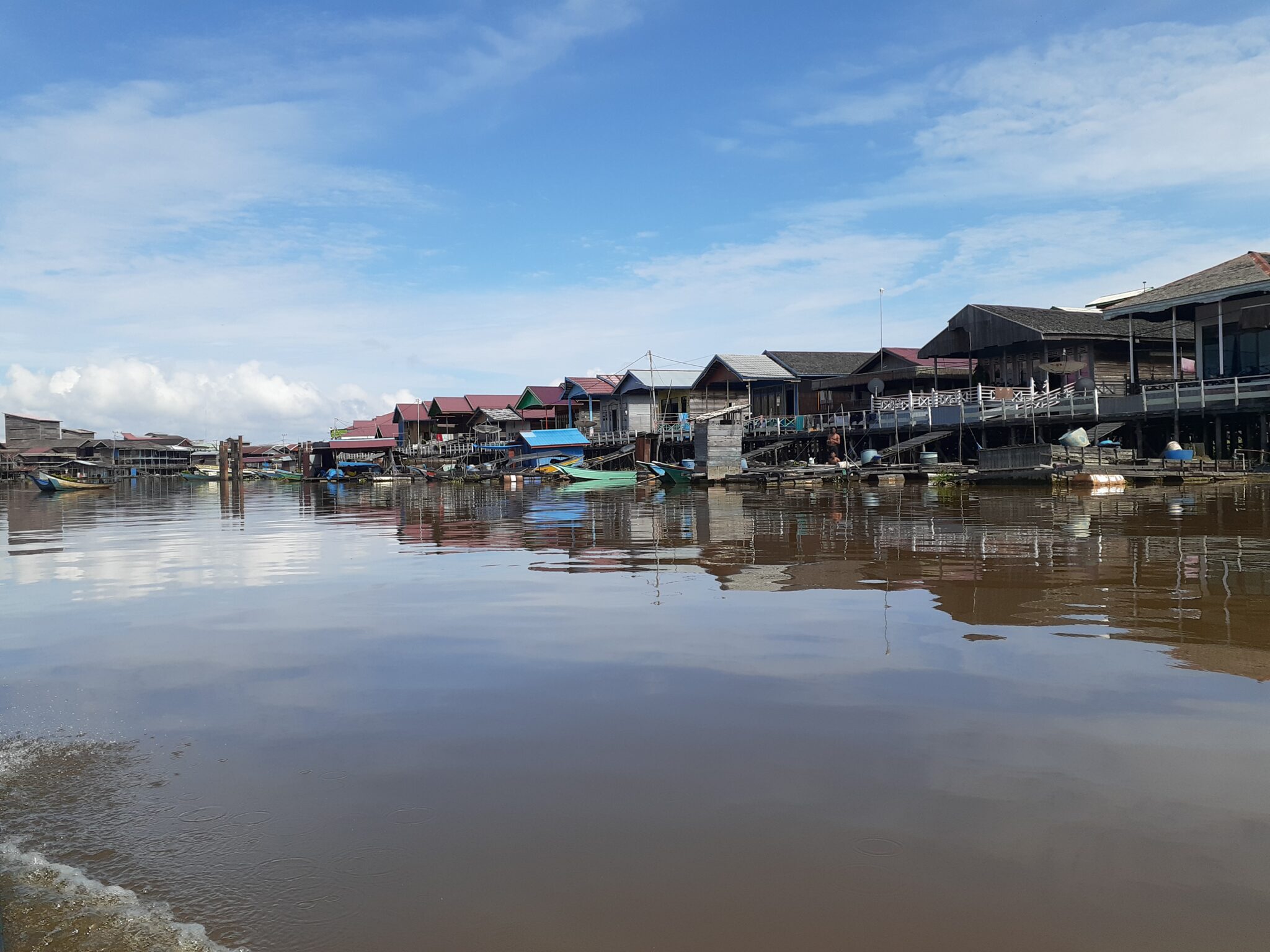 Watching Dolphins in the Mahakam River and Visiting Stilted Villages ...